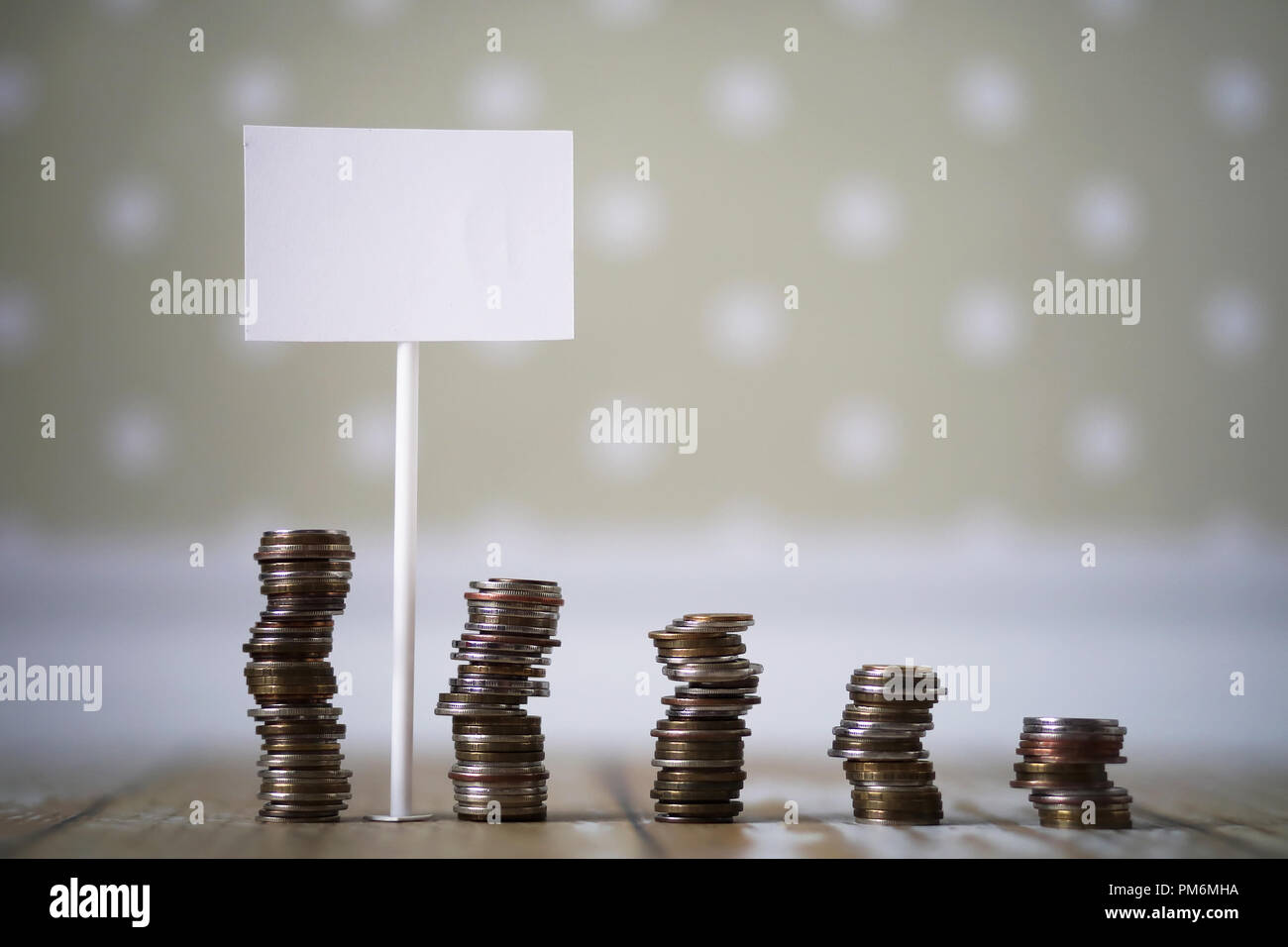 coins stacked in piles on the floor Stock Photo - Alamy