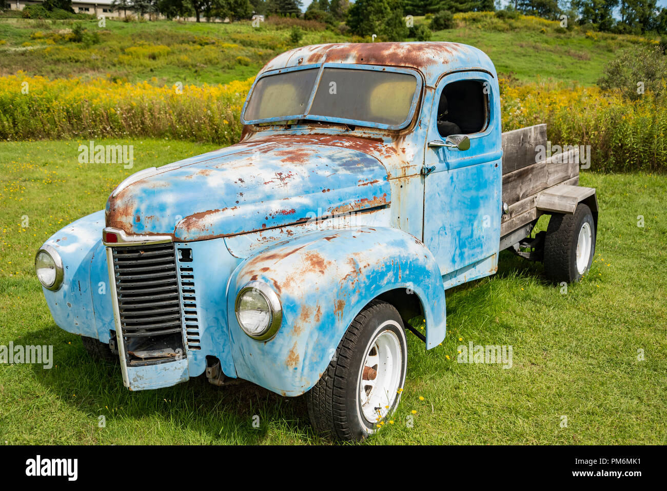 Old rusty blue truck abandoned ni a field in Stowe, Vermont USA Stock ...