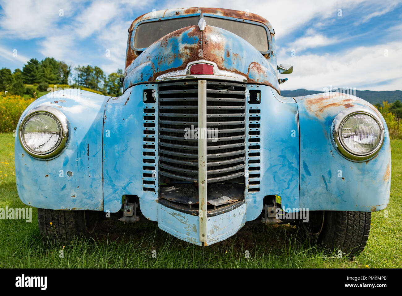 Old rusty blue truck abandoned ni a field in Stowe, Vermont USA Stock ...