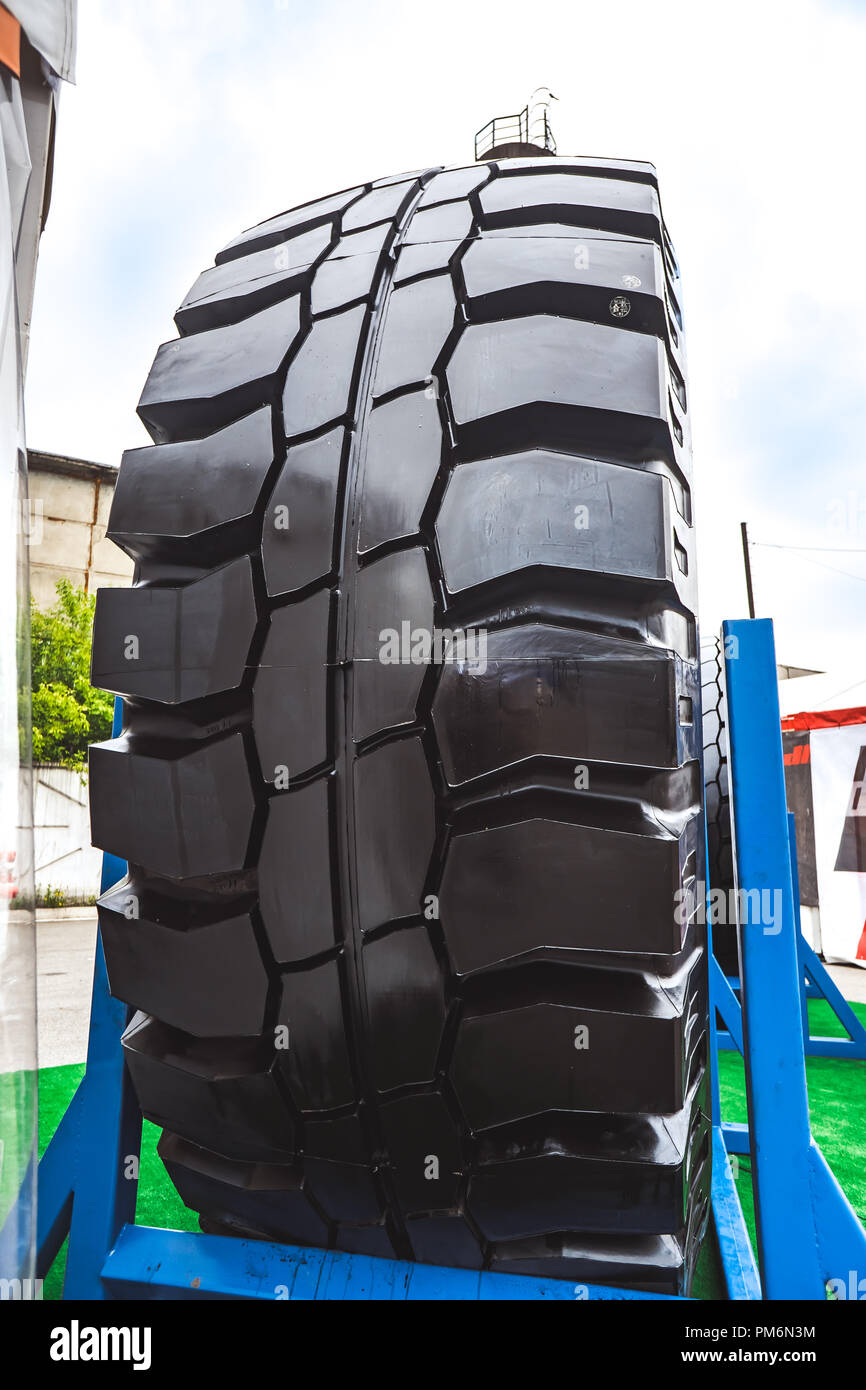 Cargo tires are new at the mining exhibition Stock Photo - Alamy