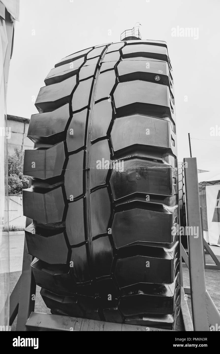 Cargo tires are new at the mining exhibition Stock Photo - Alamy