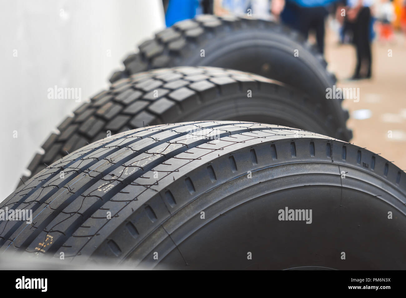 Cargo tires are new at the mining exhibition Stock Photo - Alamy