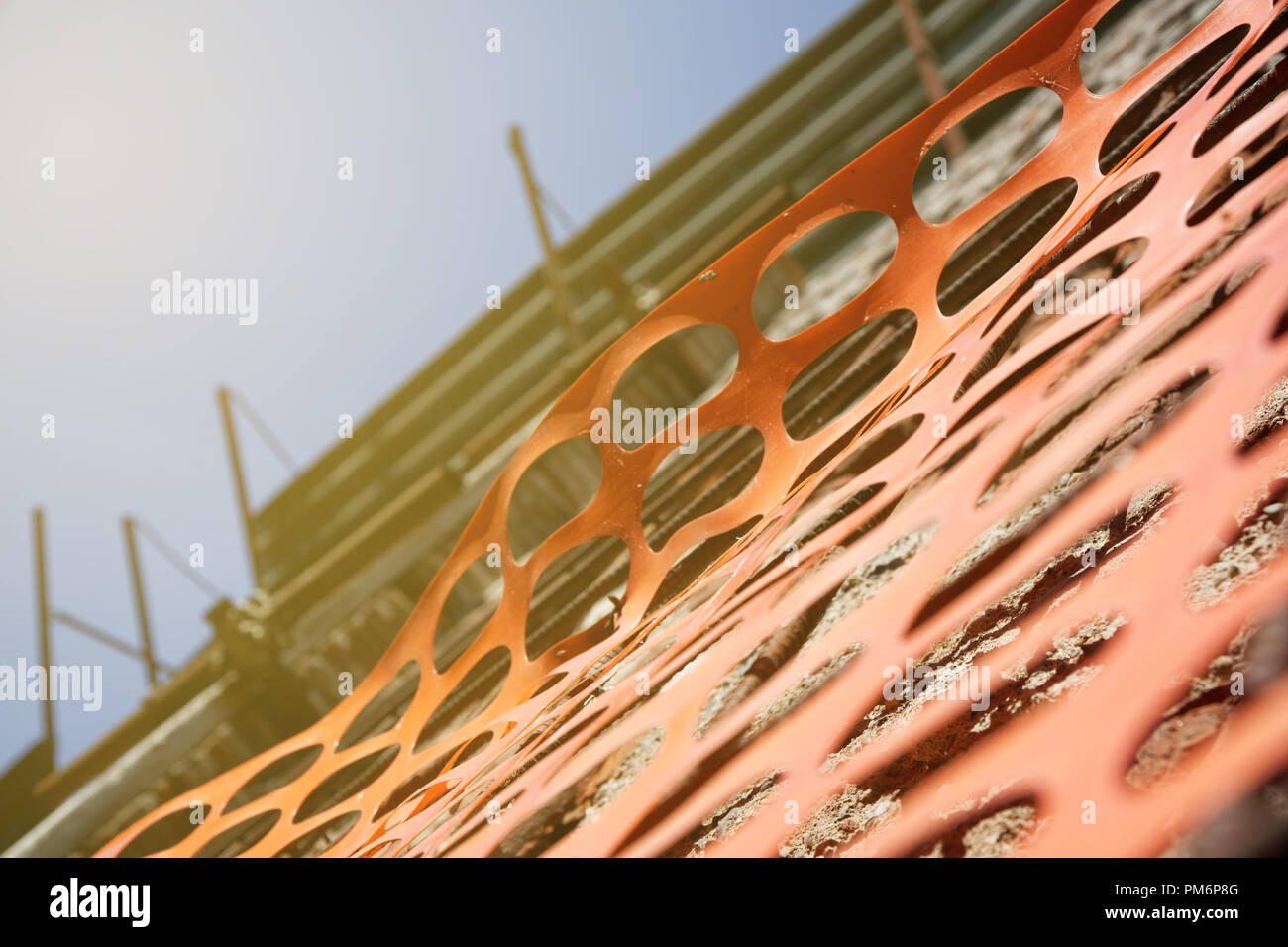 Construction safety fence, orange net around building site Stock Photo ...