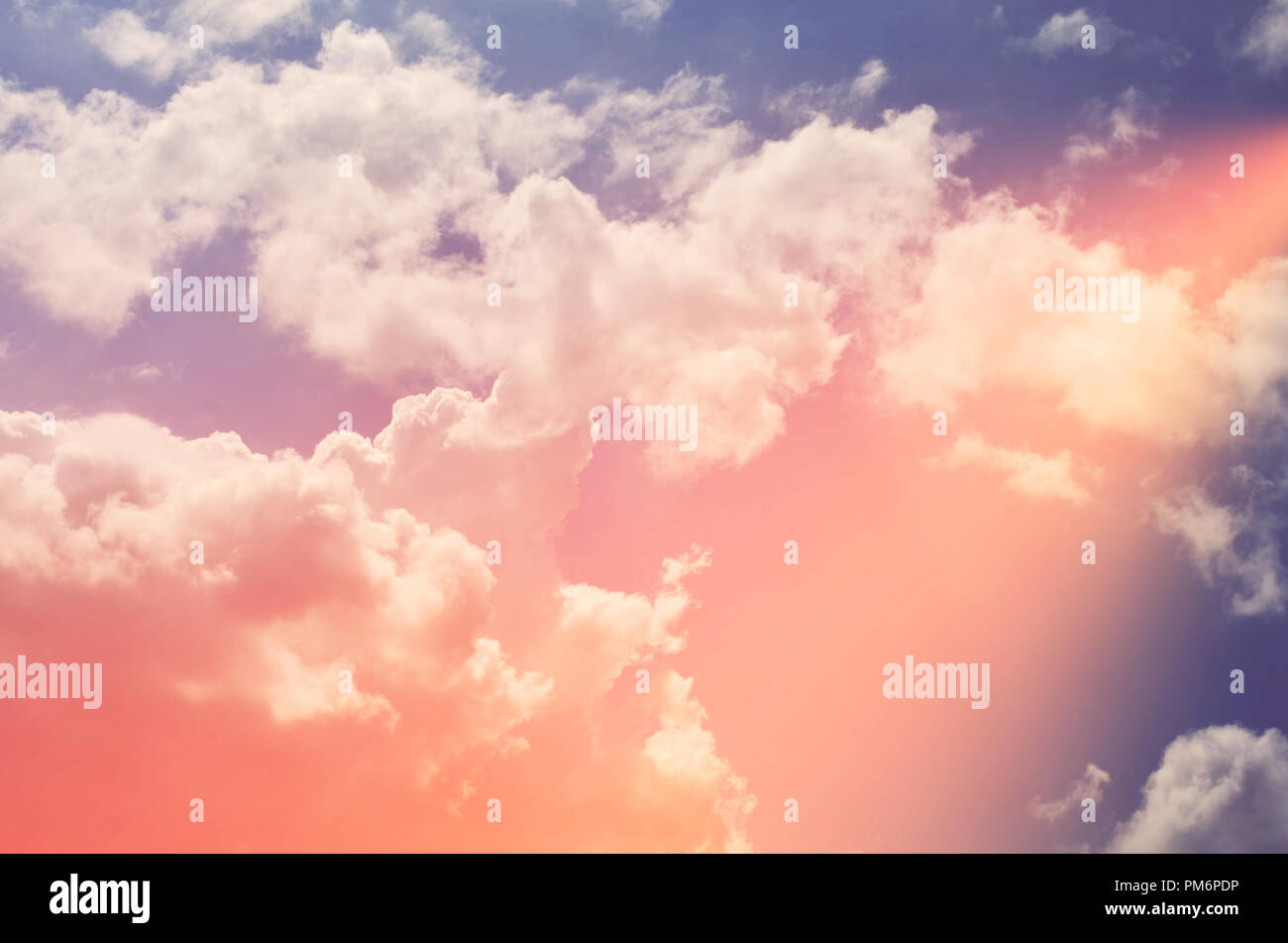 Nature background. Fluffy soft clouds in sky toned Stock Photo - Alamy