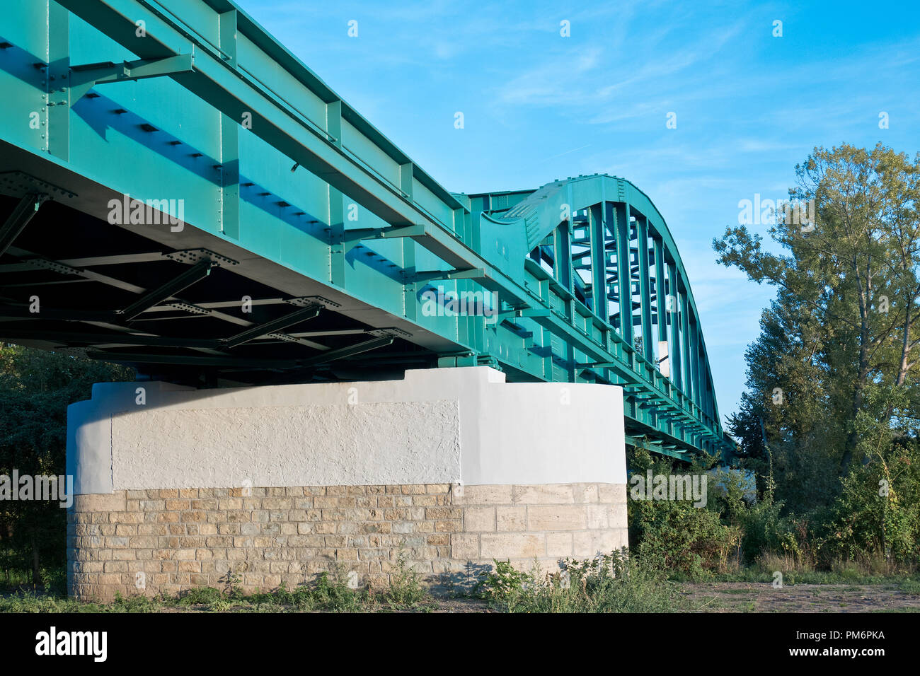 Metal bridge over river in the summer time Stock Photo - Alamy