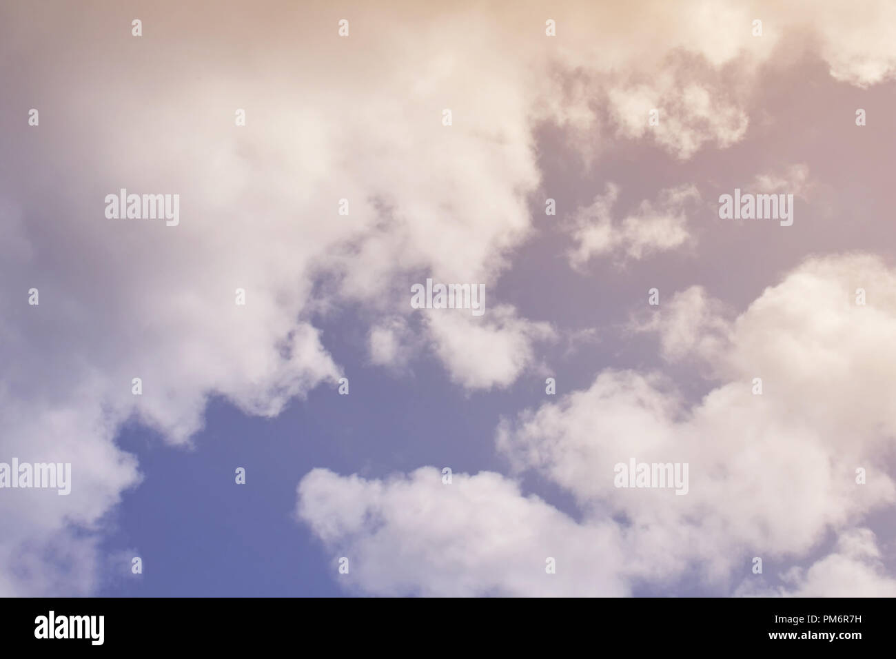 Nature background. Fluffy soft clouds in sky toned Stock Photo - Alamy