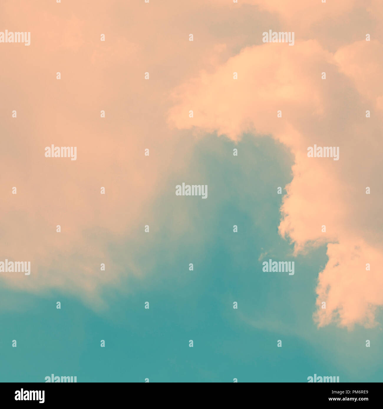 Nature background. Fluffy soft clouds in sky toned Stock Photo - Alamy