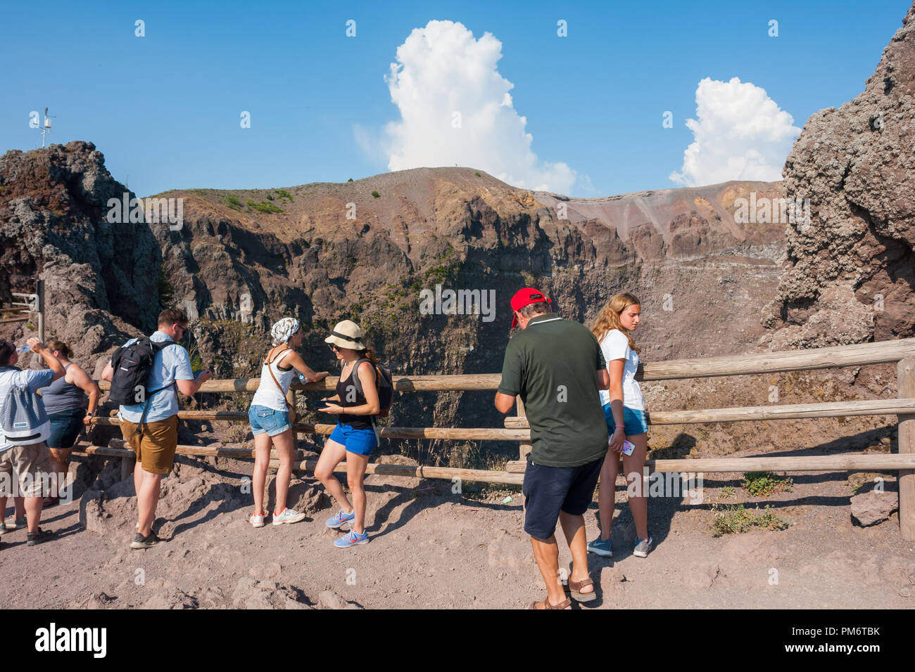 MOUNT VESUVIUS, ITALY - AUGUST 1, 2018: Tourists walk around the crater ...