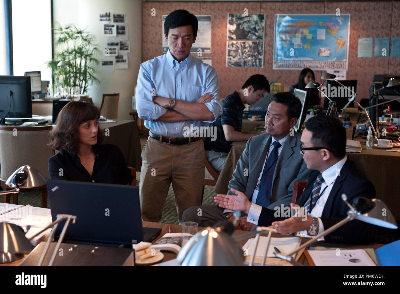 MARION COTILLARD (left) as Dr. Leonora Orantes and CHIN HAN (standing ...