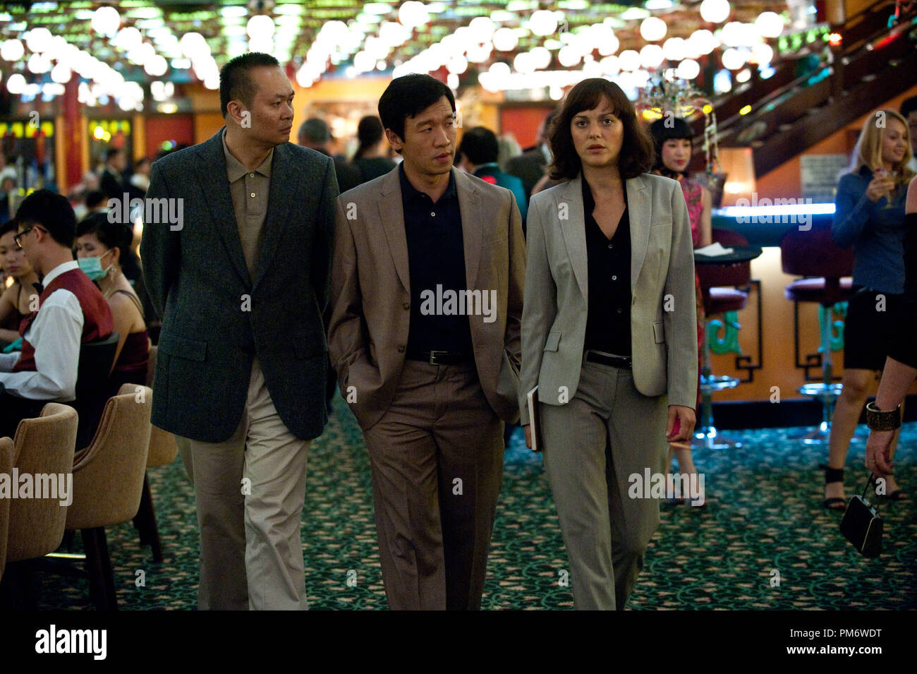CHIN HAN (center) as Sun Feng and MARION COTILLARD (right) as Dr ...