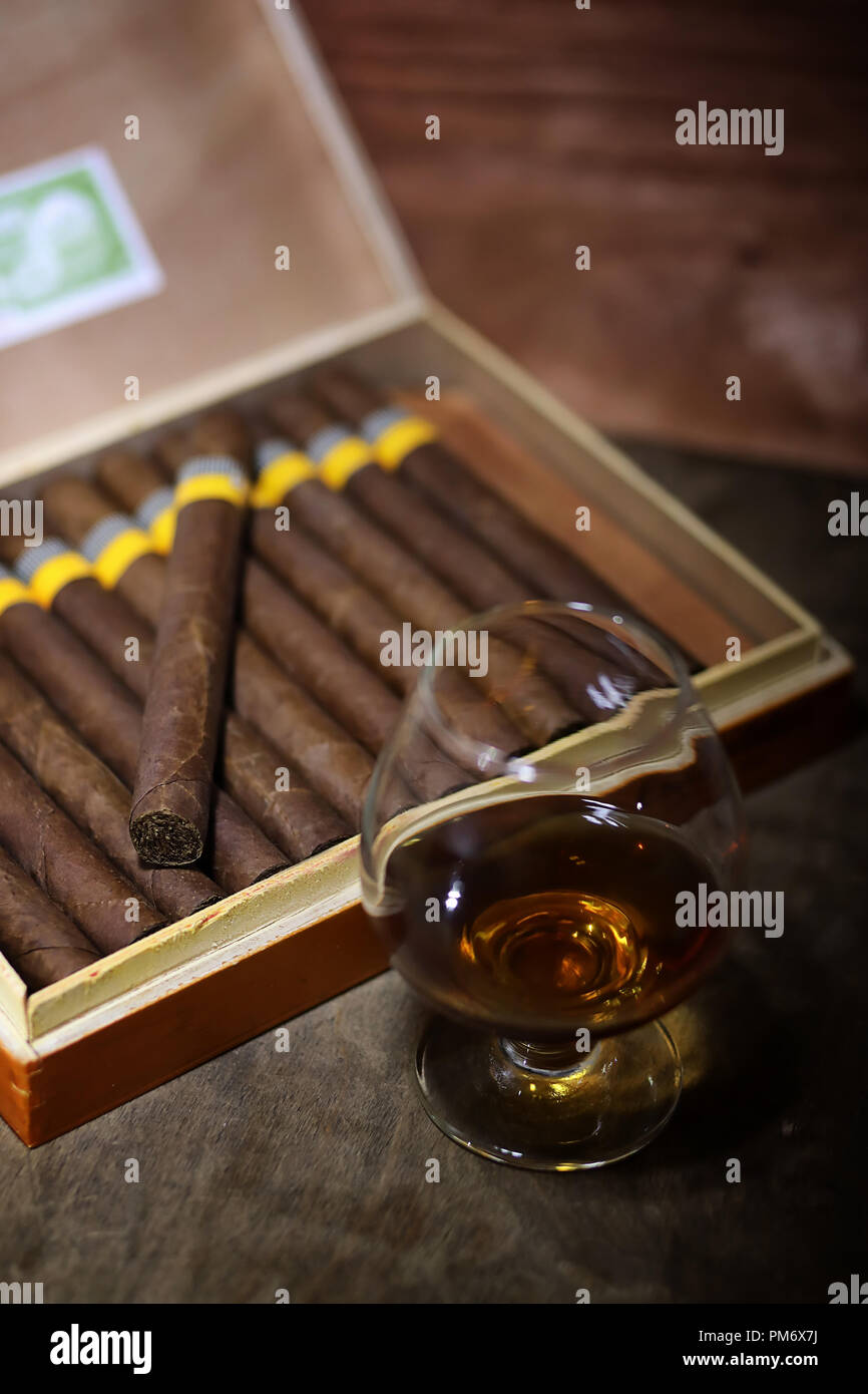 Large box of Cuban cigars on a wooden table Stock Photo - Alamy