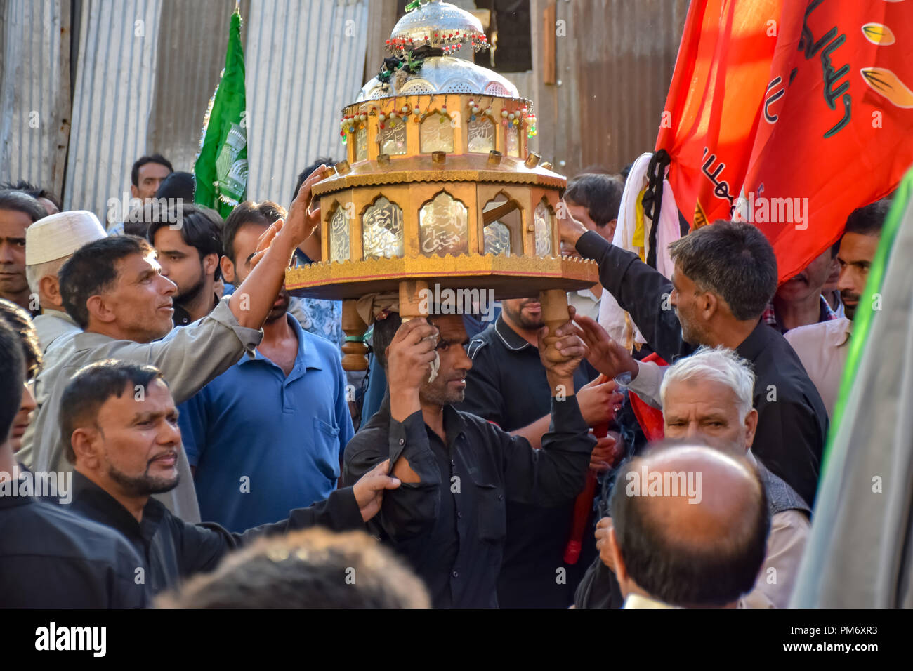 Kashmiri Shia muslim seen holding Holy Quran during a 6th day of Ashura ...