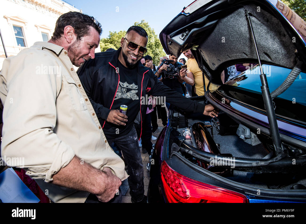 Kash Ahmad seen showing Chris Symons his new Super car during the show ...
