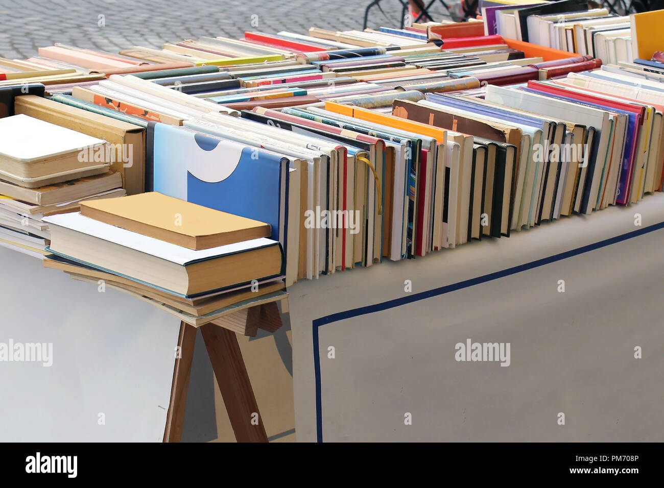 Second hand books sold on city street Stock Photo - Alamy