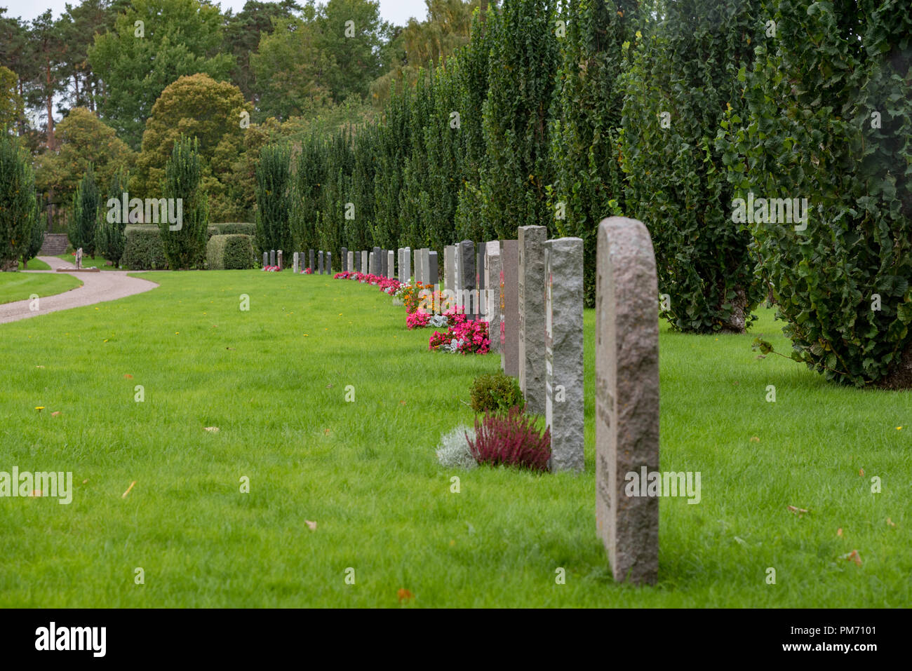 line of gravestones and flowers in a swedish cemetery autumn 2018 Stock ...