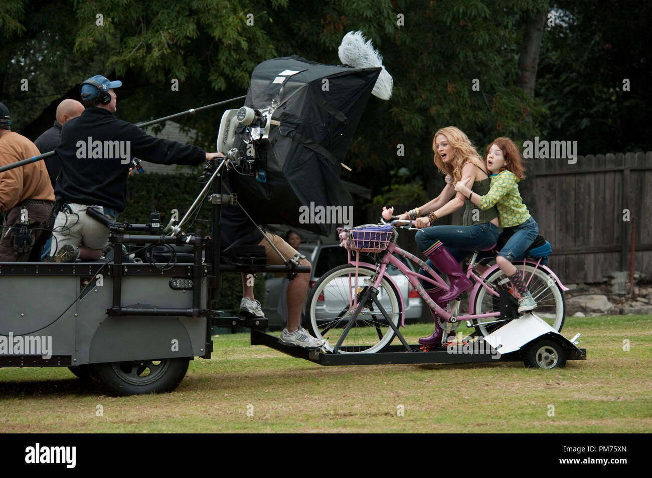 (Left to right on bike.) Heather Graham and Jordana Beatty shoot a ...