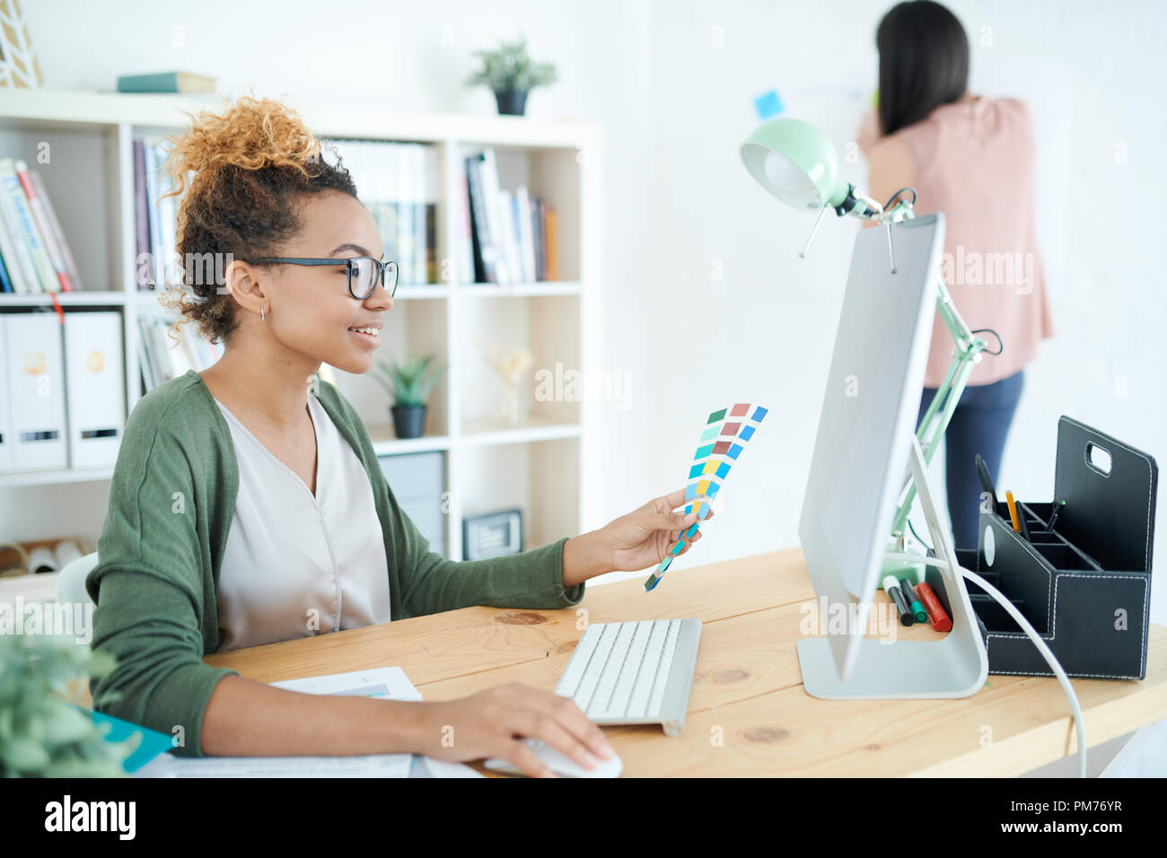Creative African-American Designer at Desk Stock Photo - Alamy
