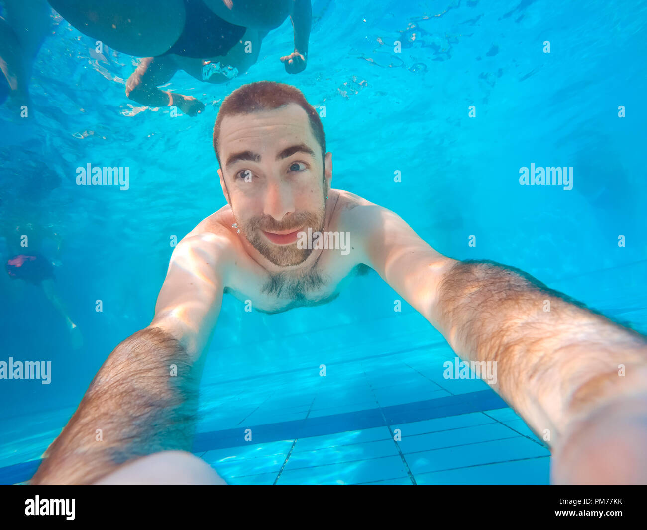 Young handsome man diving underwater in a swimming pool Stock Photo - Alamy