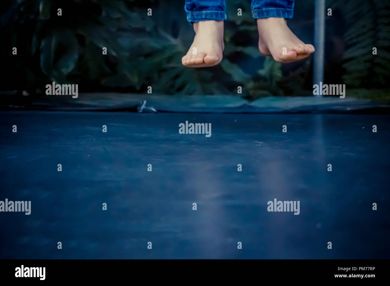 Legs floating in the air after jumping on the trampoline Stock Photo ...