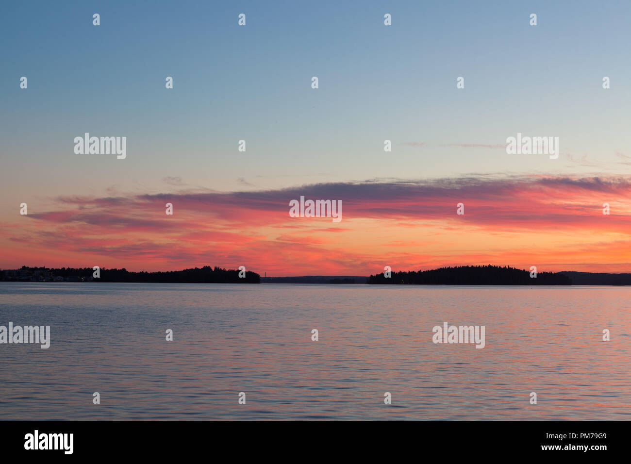 Calm sunset and clouds over lake Stock Photo - Alamy