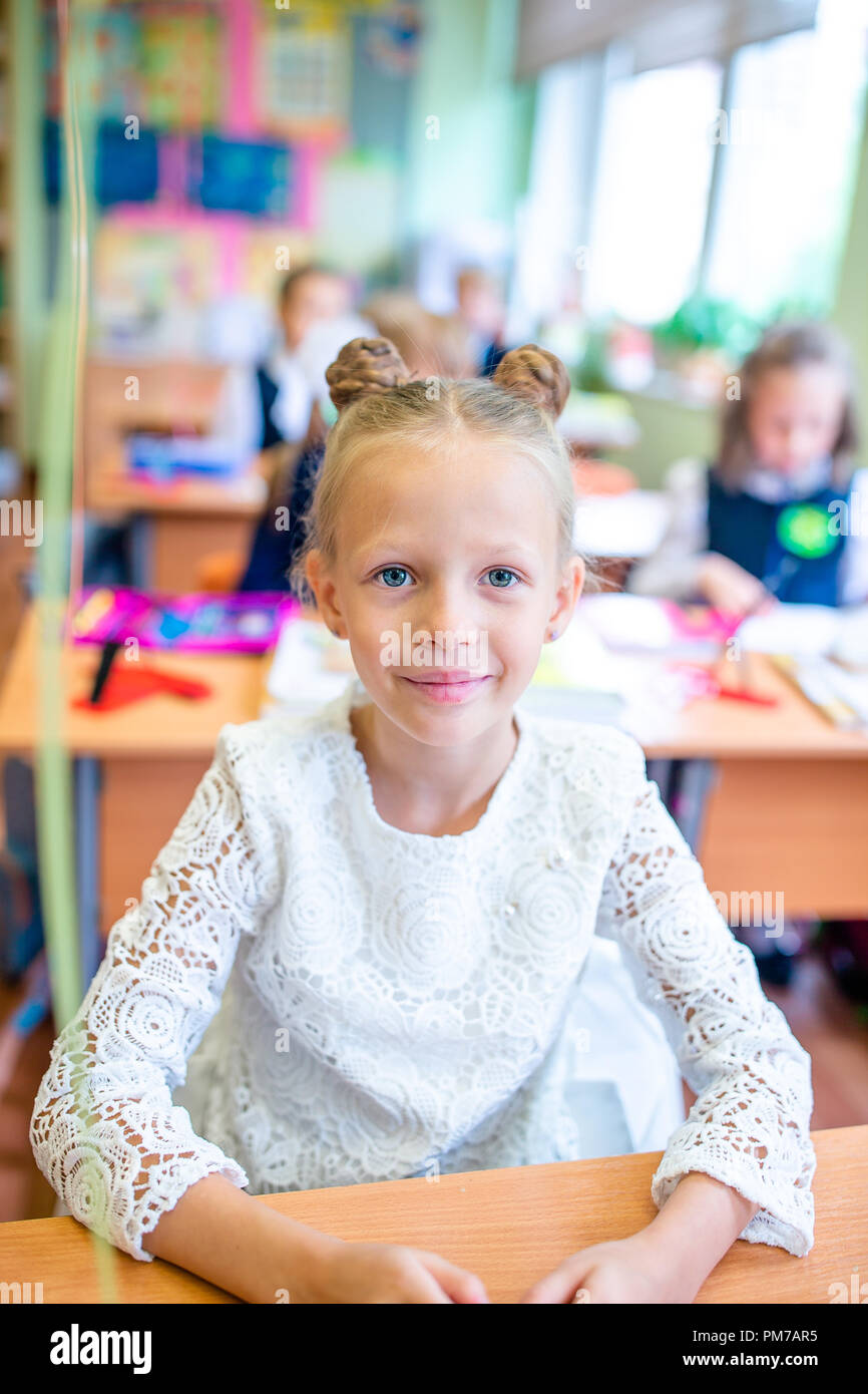 Adorable little school girl with notes and pencils outdoor Stock Photo ...
