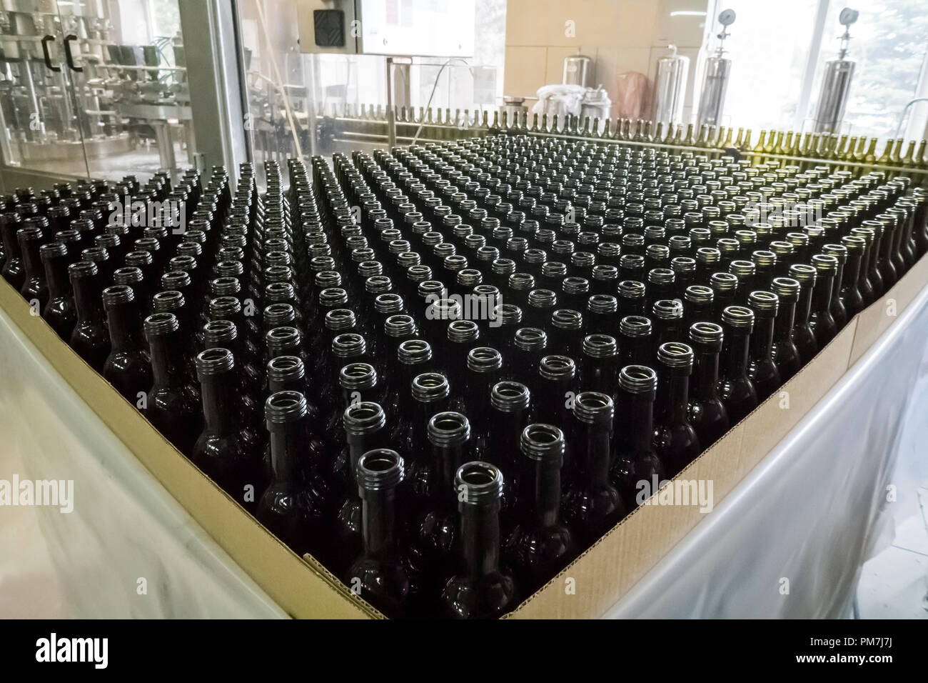 Bottling and sealing conveyor line at winery factory Stock Photo - Alamy