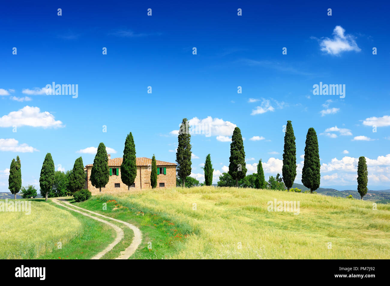 Italian landscape, typical Tuscany farmhouse among fields and cypresses ...