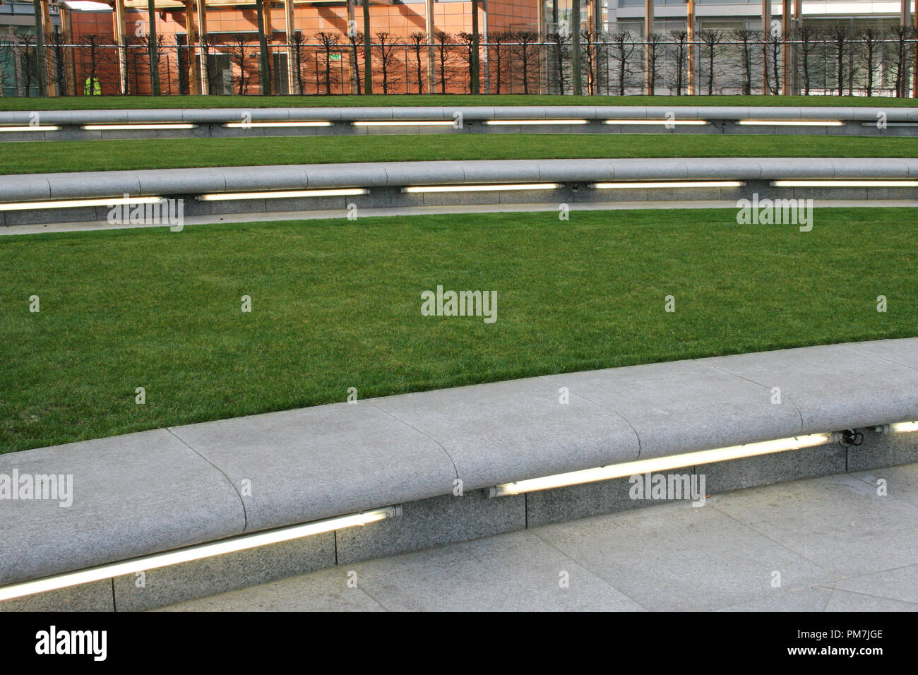 Long Bench and Grass in City Park Stock Photo - Alamy