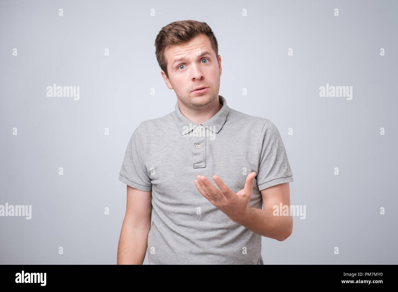 Young caucasian man half-length portrait isolated on white studio ...