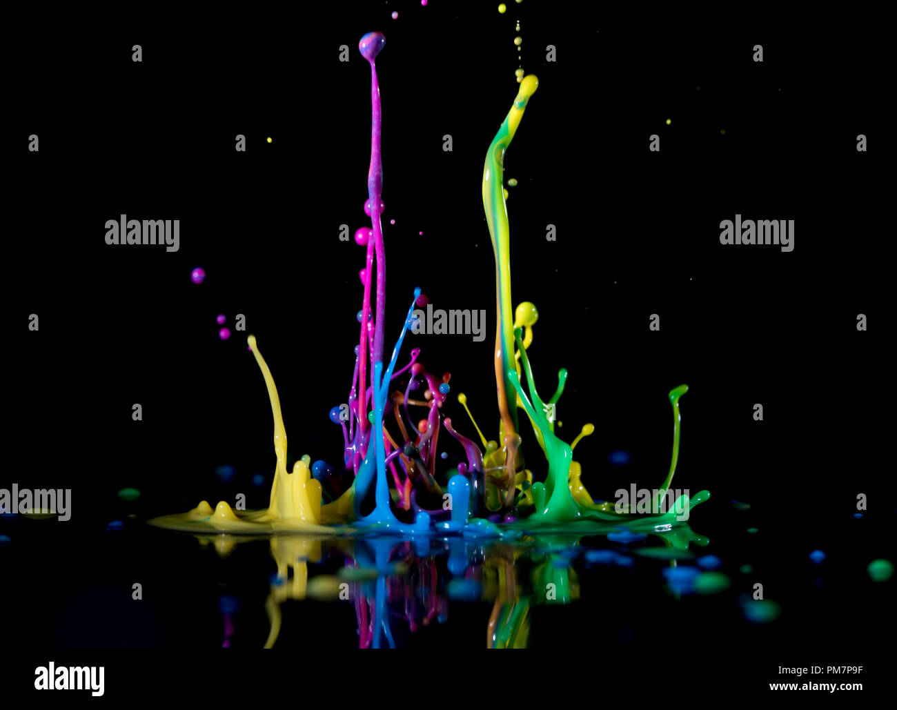 Abstract sculptures of colorful splashes of paint. Dancing liquid on a ...