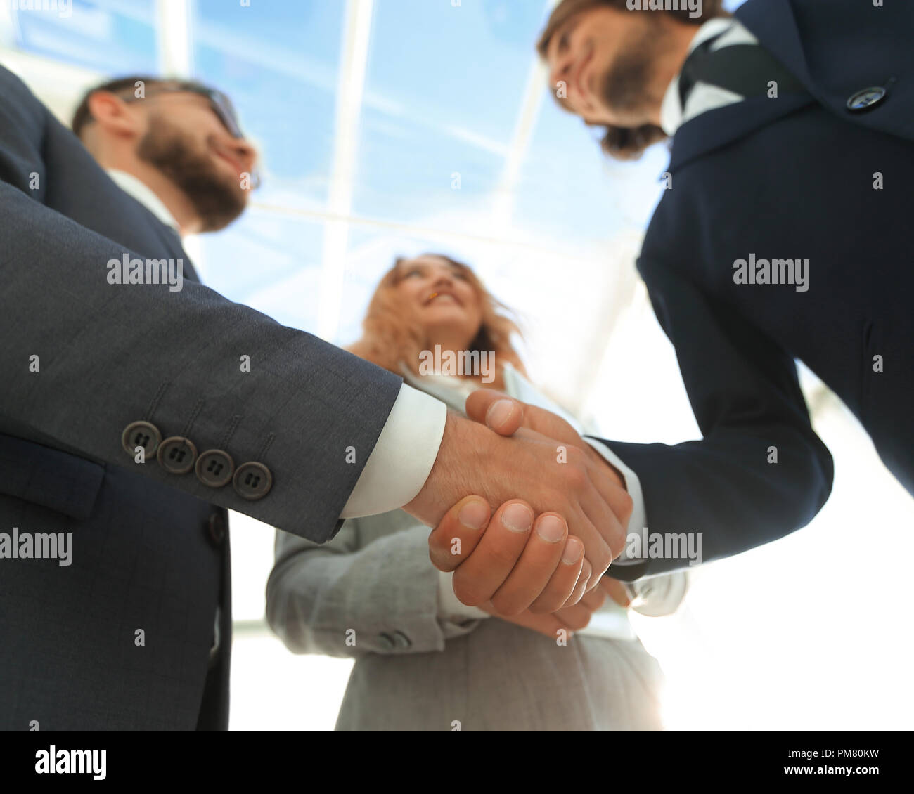 Photo of handshake of two happy businessmen Stock Photo - Alamy