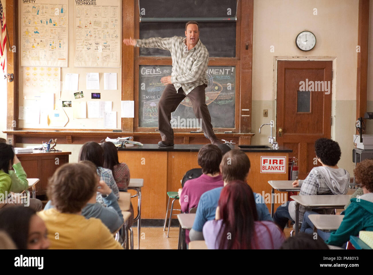 Scott Voss (Kevin James) teaches his students from on top of a desk in ...