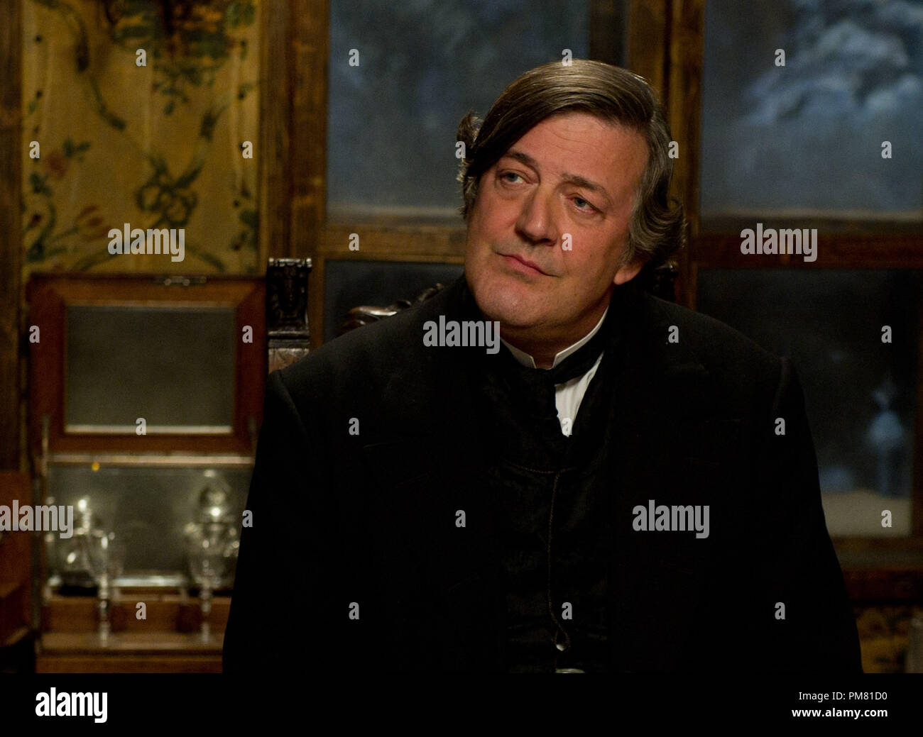 STEPHEN FRY as Mycroft Holmes in Warner Bros. Pictures and Village ...