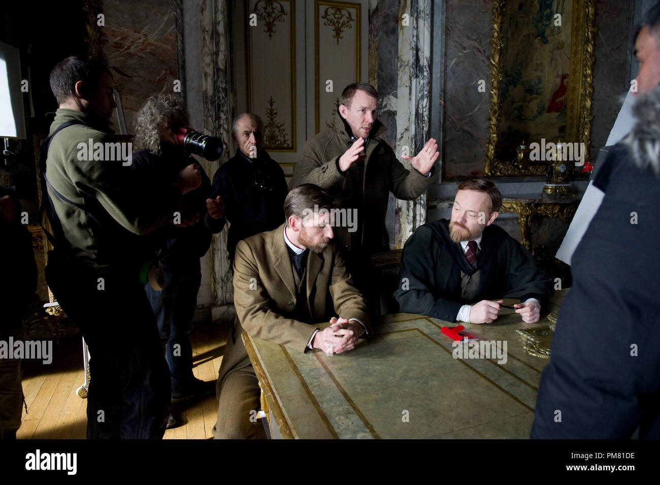 (L-r) Director GUY RITCHIE and JARED HARRIS on the set of Warner Bros ...