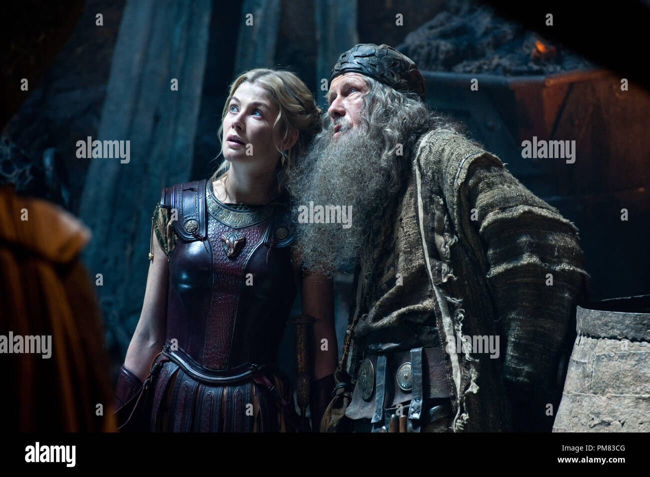 (L-r) ROSAMUND PIKE as Andromeda and BILL NIGHY as Hephaestus in Warner ...