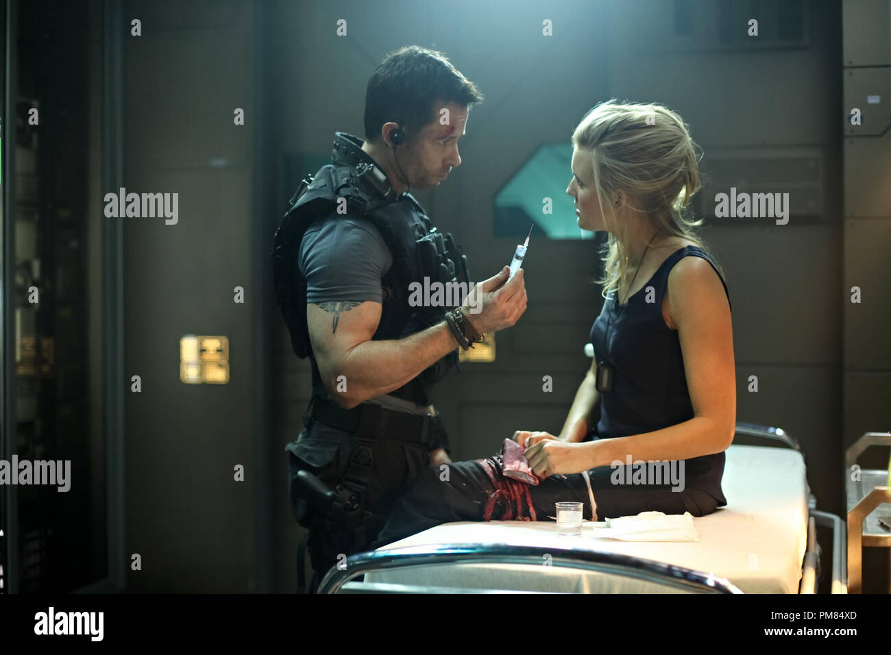 Guy Pearce and Maggie Grace star in Open Road Films' Lock-Out Stock ...