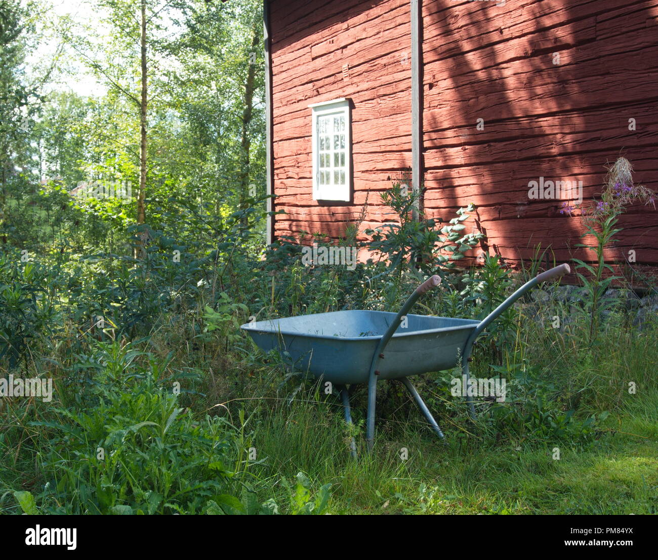 Wheelbarrow full of gardening tools hi-res stock photography and images ...