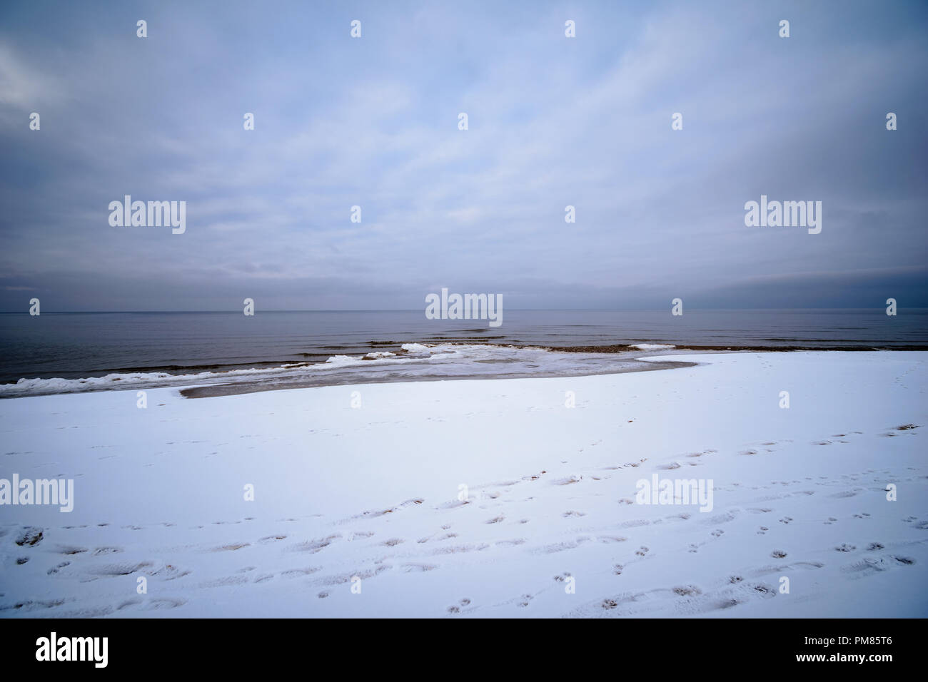 frozen dunes by the sea with ice water and snow on the beach sand Stock ...