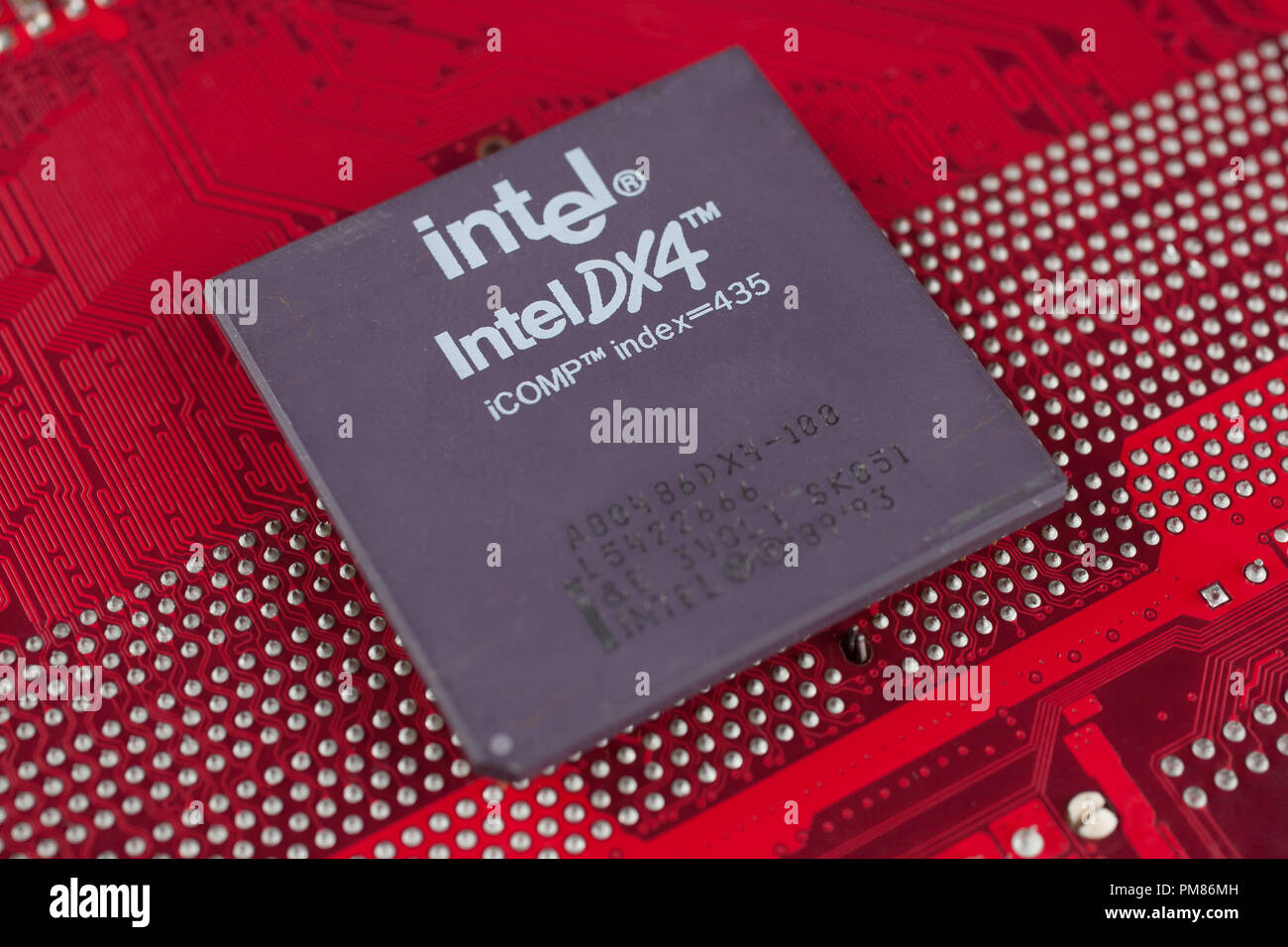 KYIV, UKRAINE - July 28, 2018. Intel 486 DX4 processor on red circuit ...
