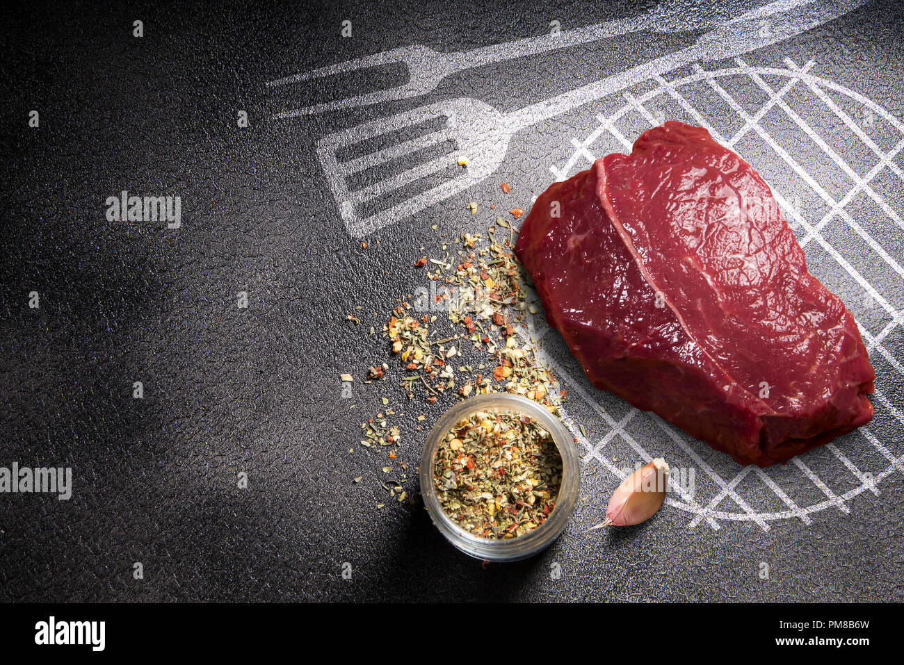 piece of meat on a dark background Stock Photo - Alamy