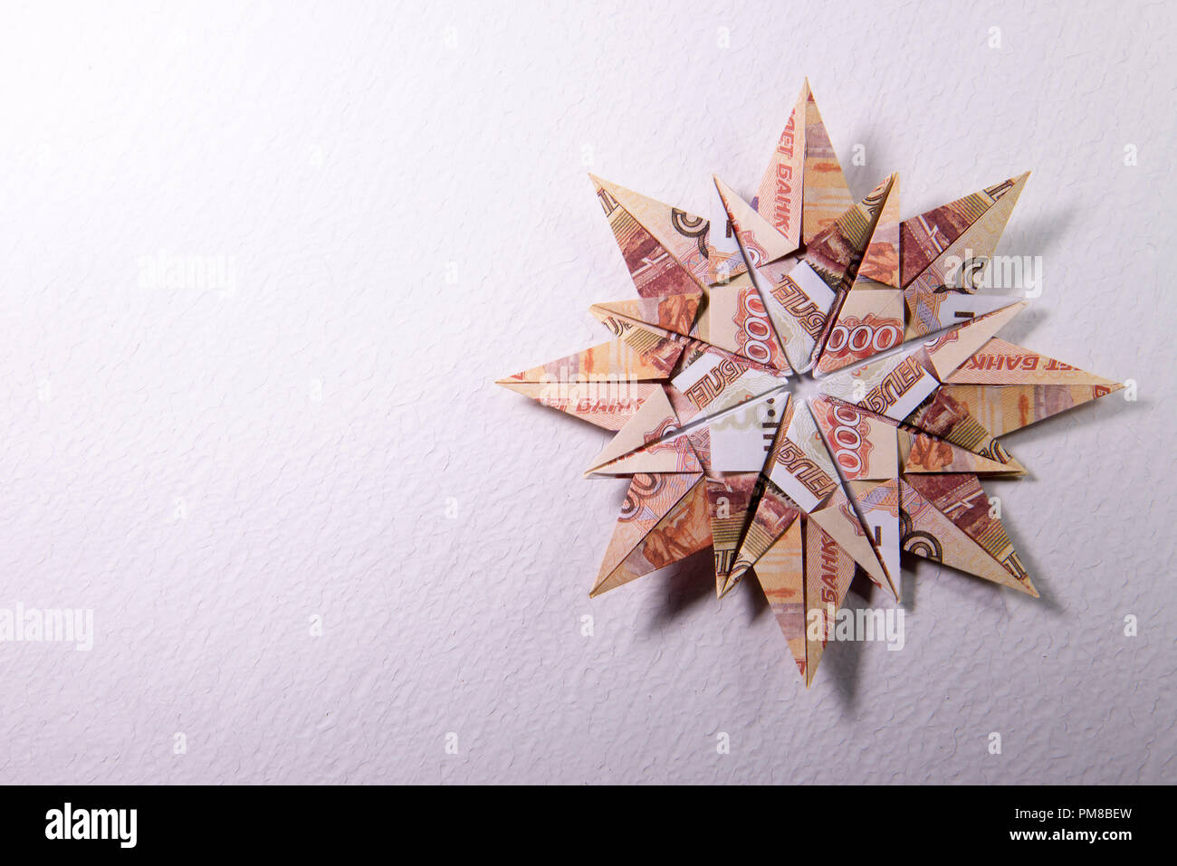 Money Origami snowflake Stock Photo - Alamy