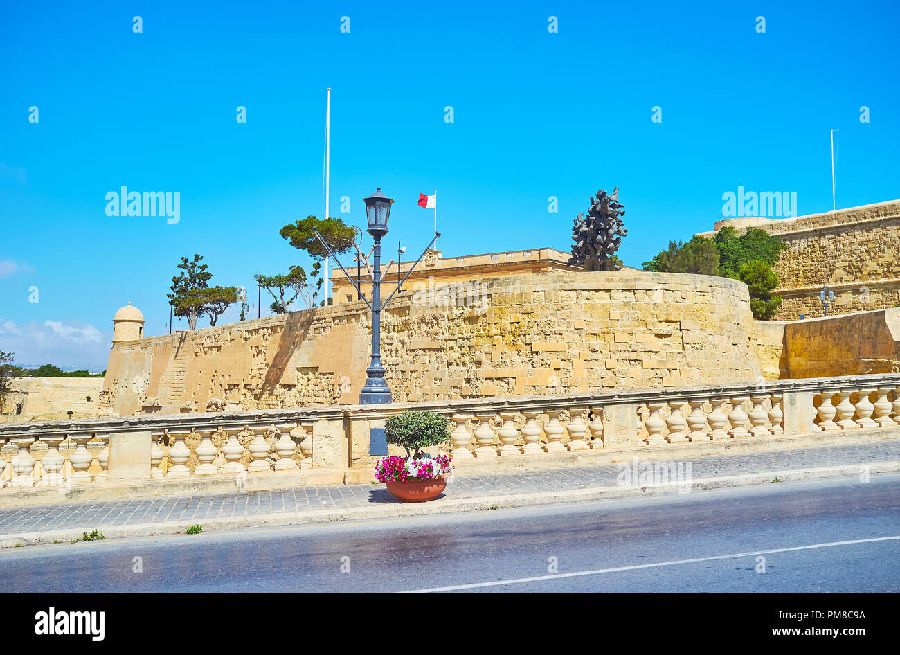 The massive wall of St James bastion behind the stone handrail ...