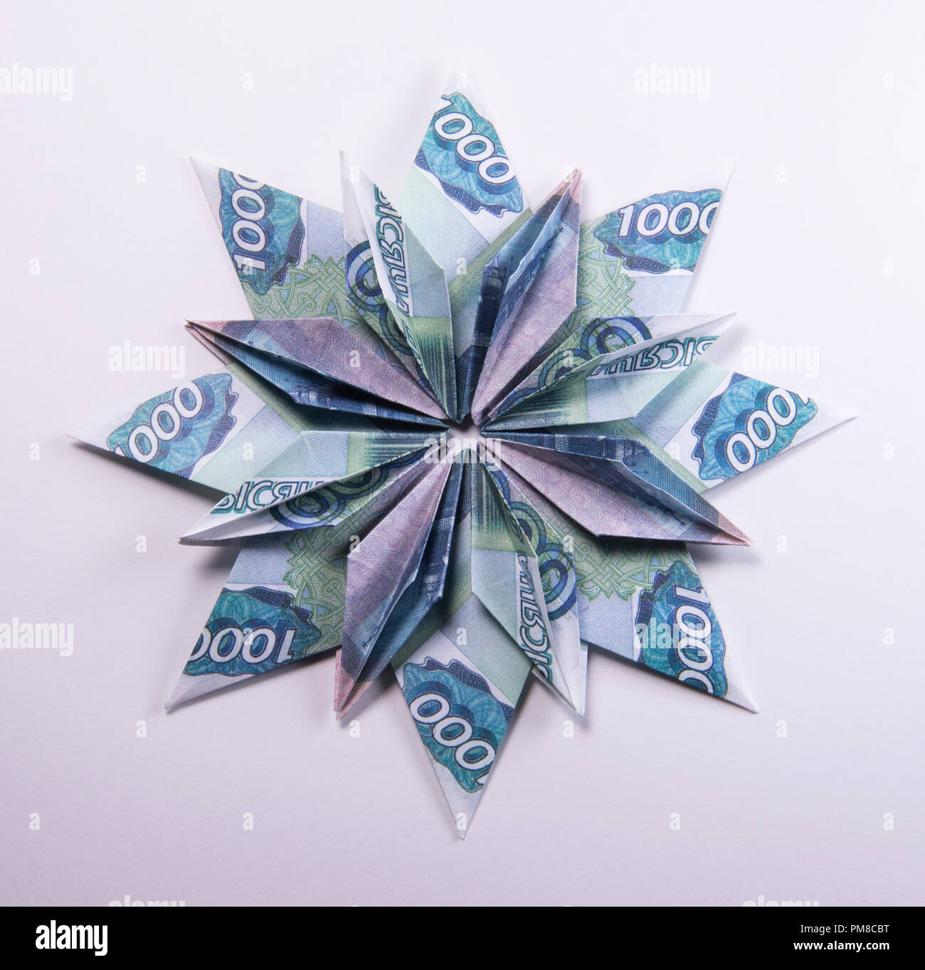 Money Origami snowflake Stock Photo - Alamy