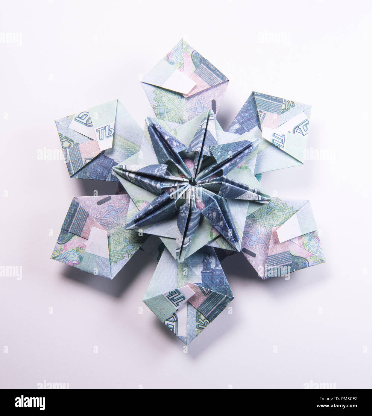 Money Origami snowflake Stock Photo - Alamy