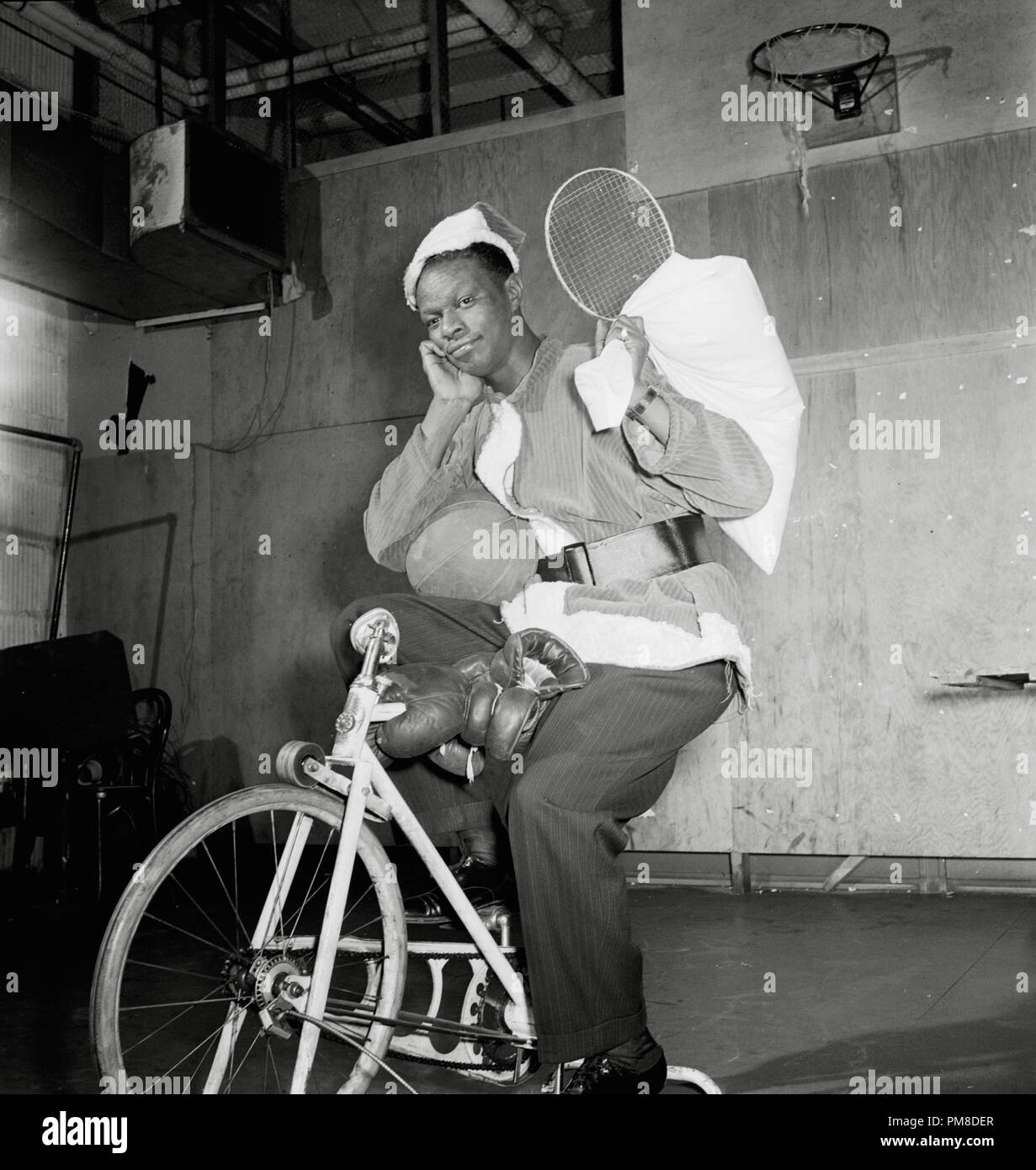Nat King Cole, playing Santa Claus in New York, N.Y., circa 1941 File ...