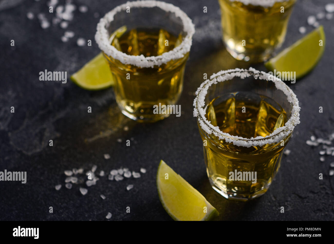 Gold tequila shot black background hi-res stock photography and images ...