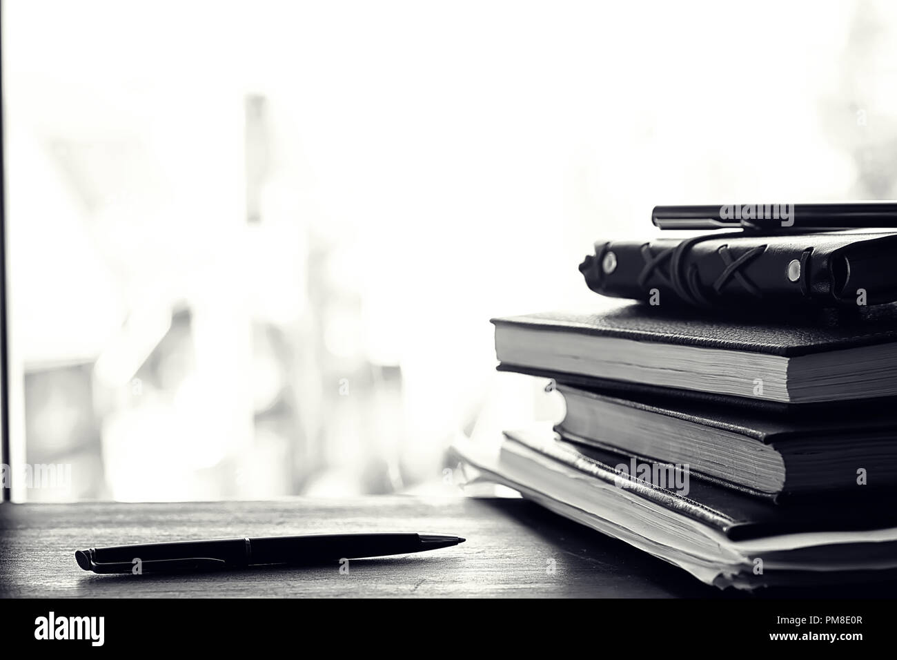 A stack of textbooks on a table Stock Photo - Alamy