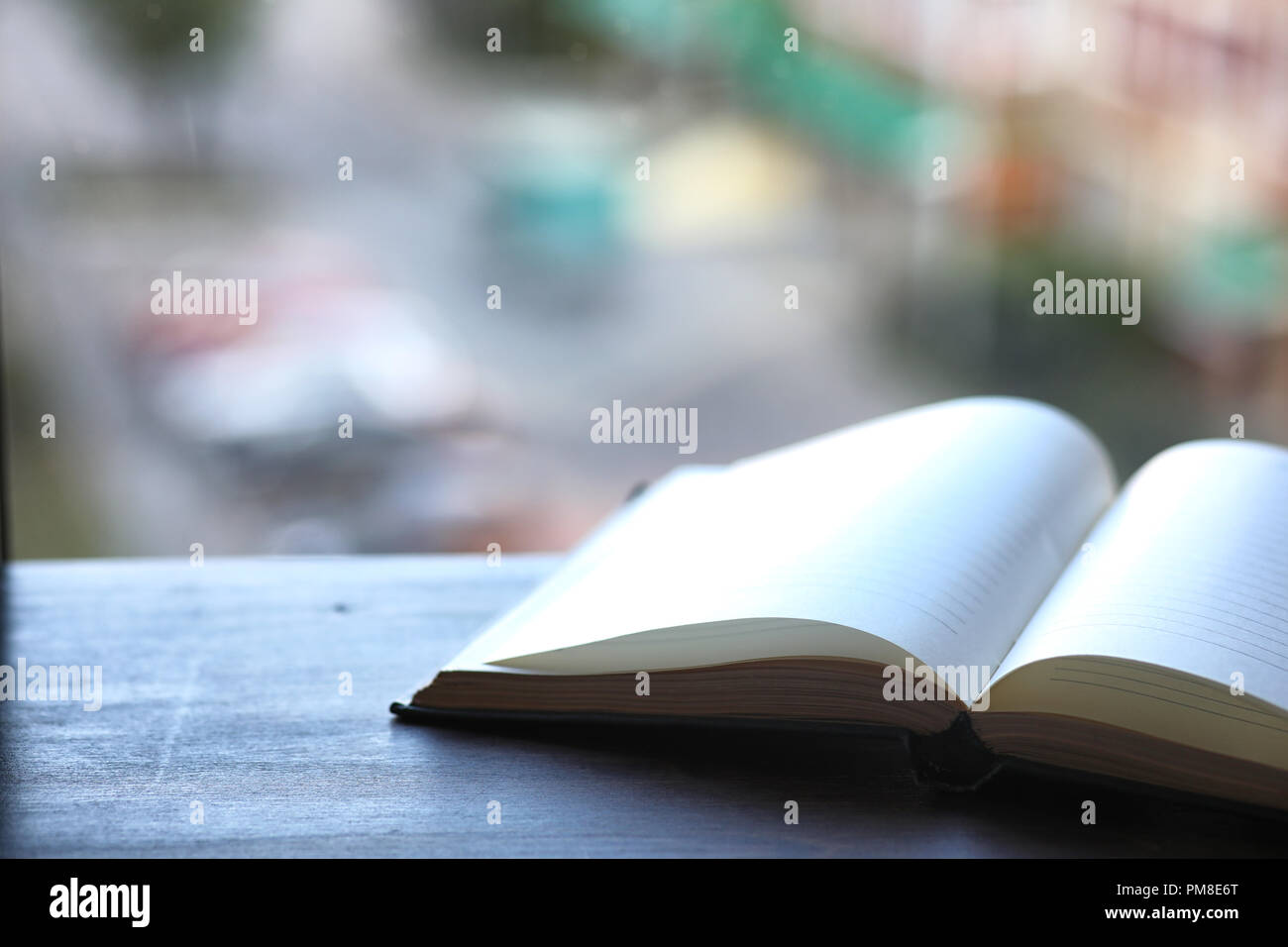 open book and a table Stock Photo - Alamy
