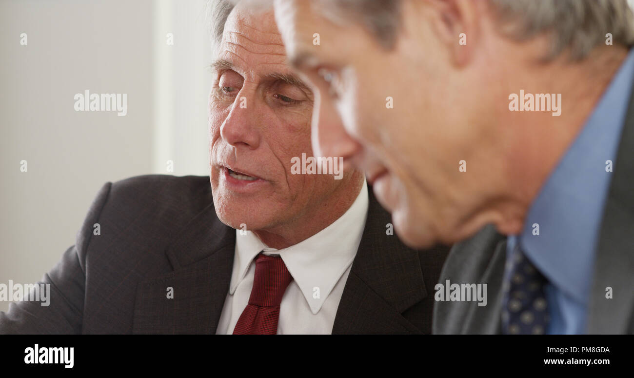 Senior businessmen talking in the office Stock Photo - Alamy