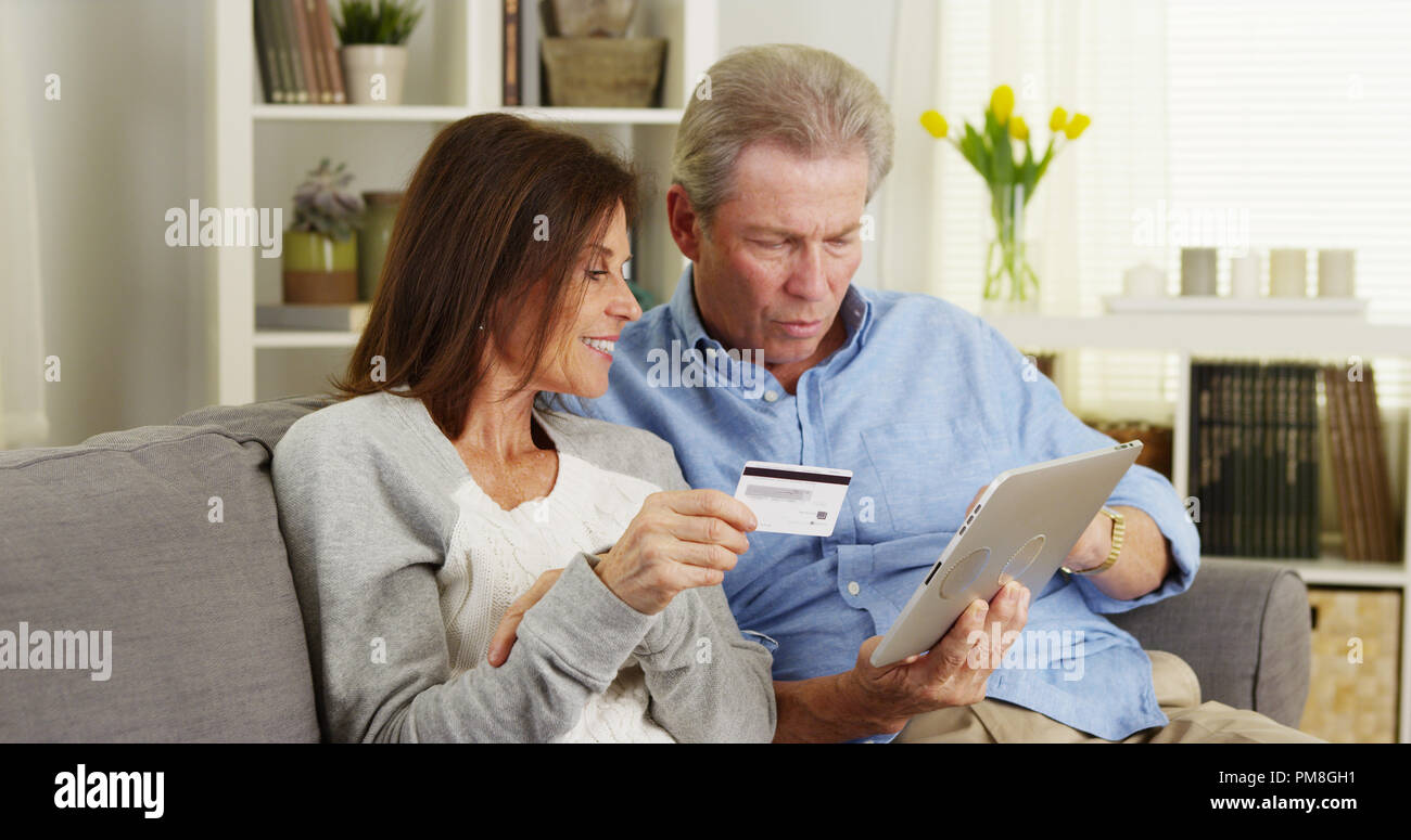 Senior grandparents couple talking using hi-res stock photography and ...